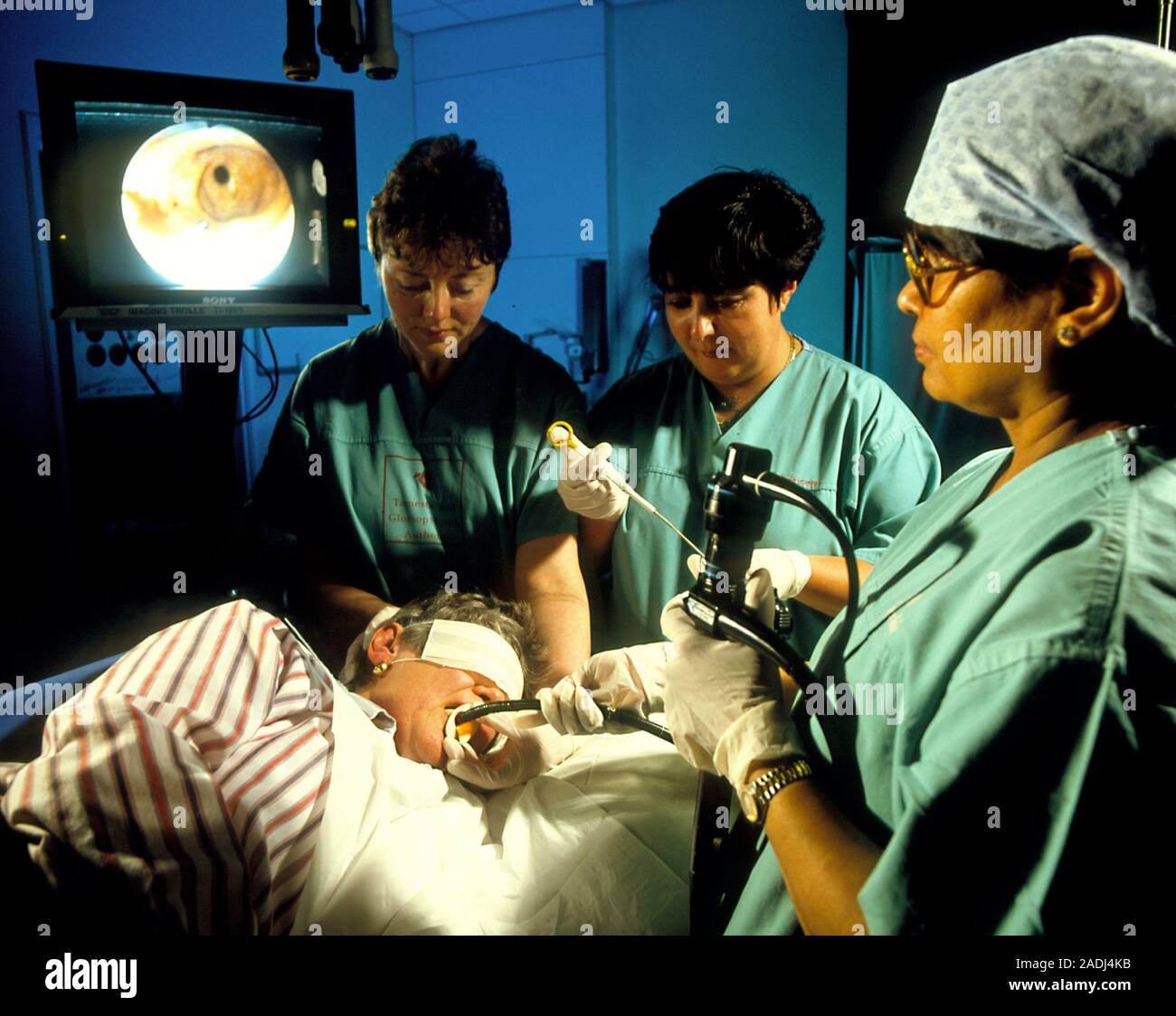 Endoscopy. Doctors performing an endoscopy (gastroscopy) examination of ...
