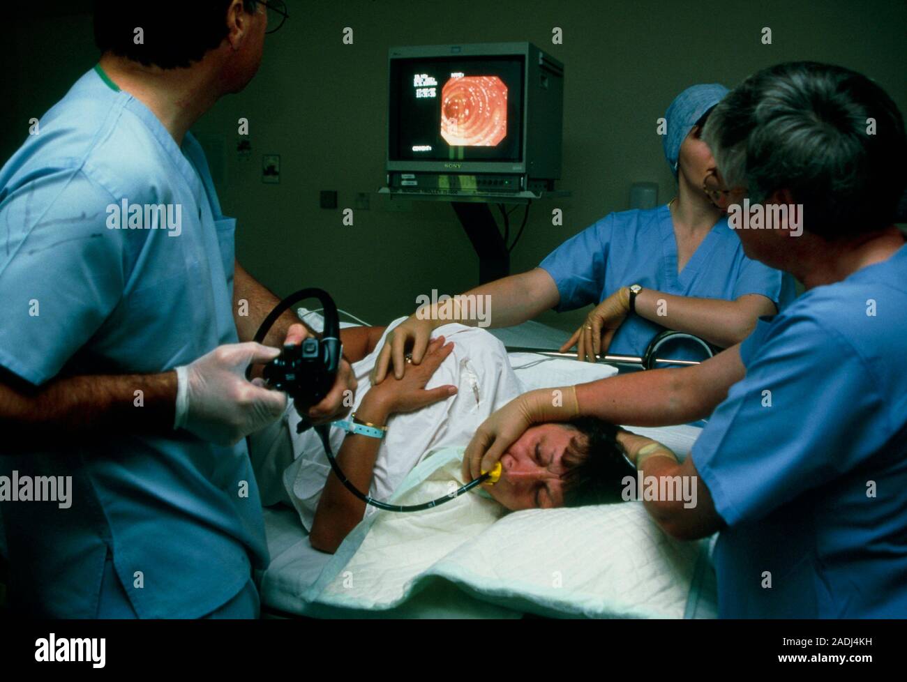 Bronchoscopy. Flexible broncho- scope (black) in a female patient's ...