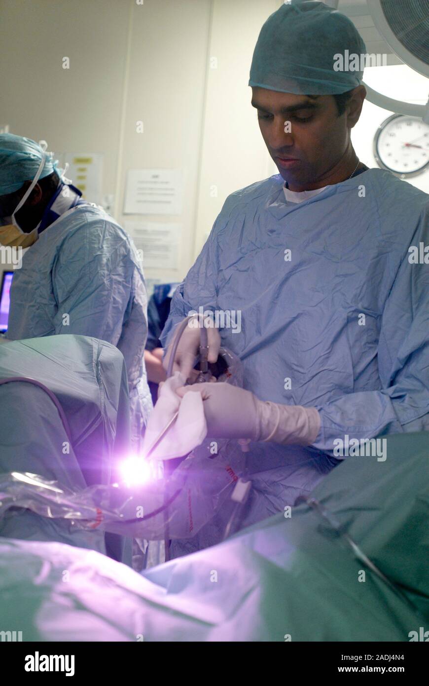 MODEL RELEASED. Endoscopy. Surgeon holding an endoscope probe during ...