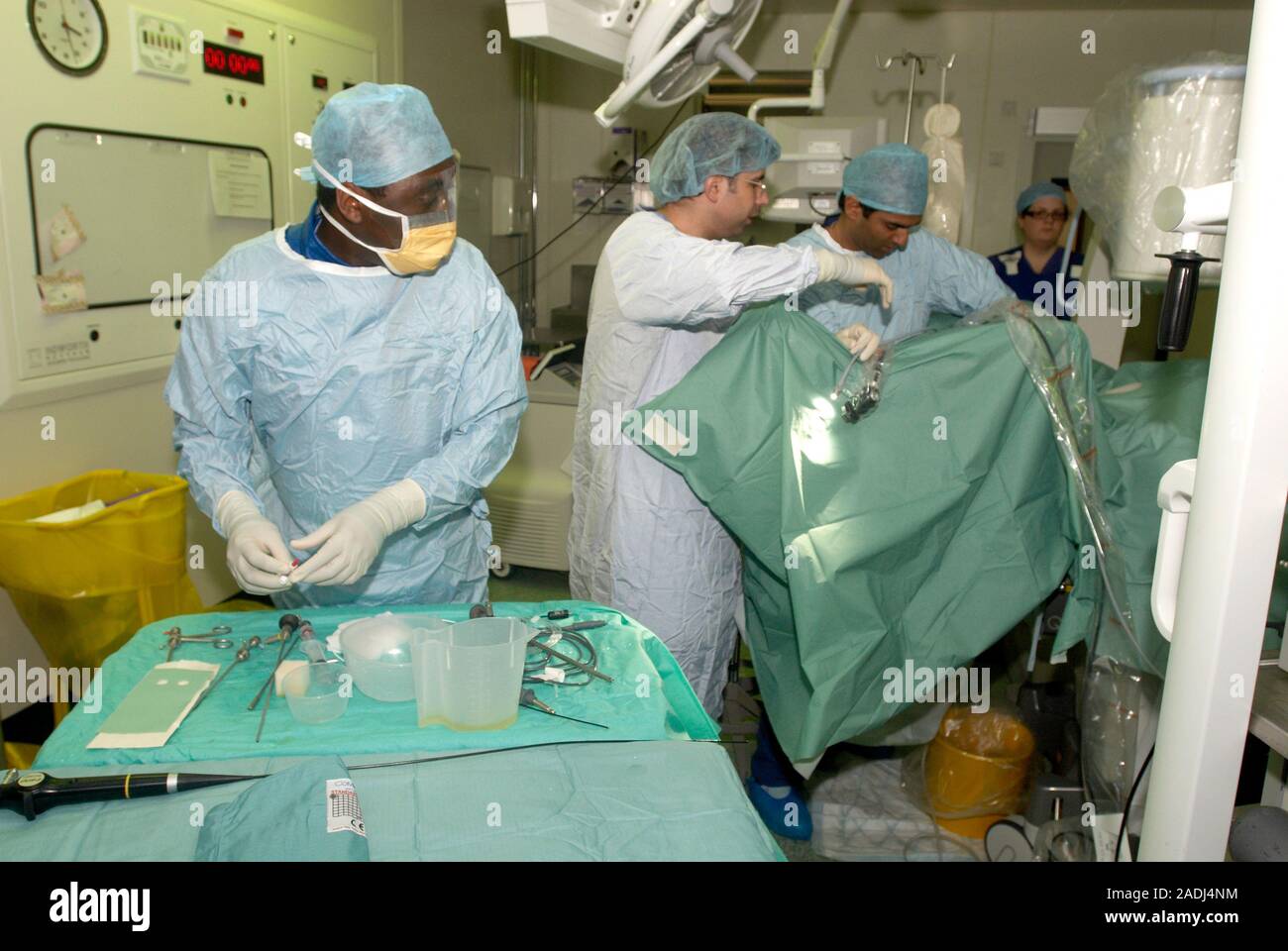 MODEL RELEASED. Endoscopy. Surgical team during urogenital endoscopy ...