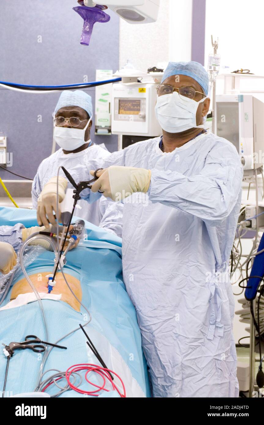 Hernia operation. Surgeon performing laparoscopic surgery (keyhole ...