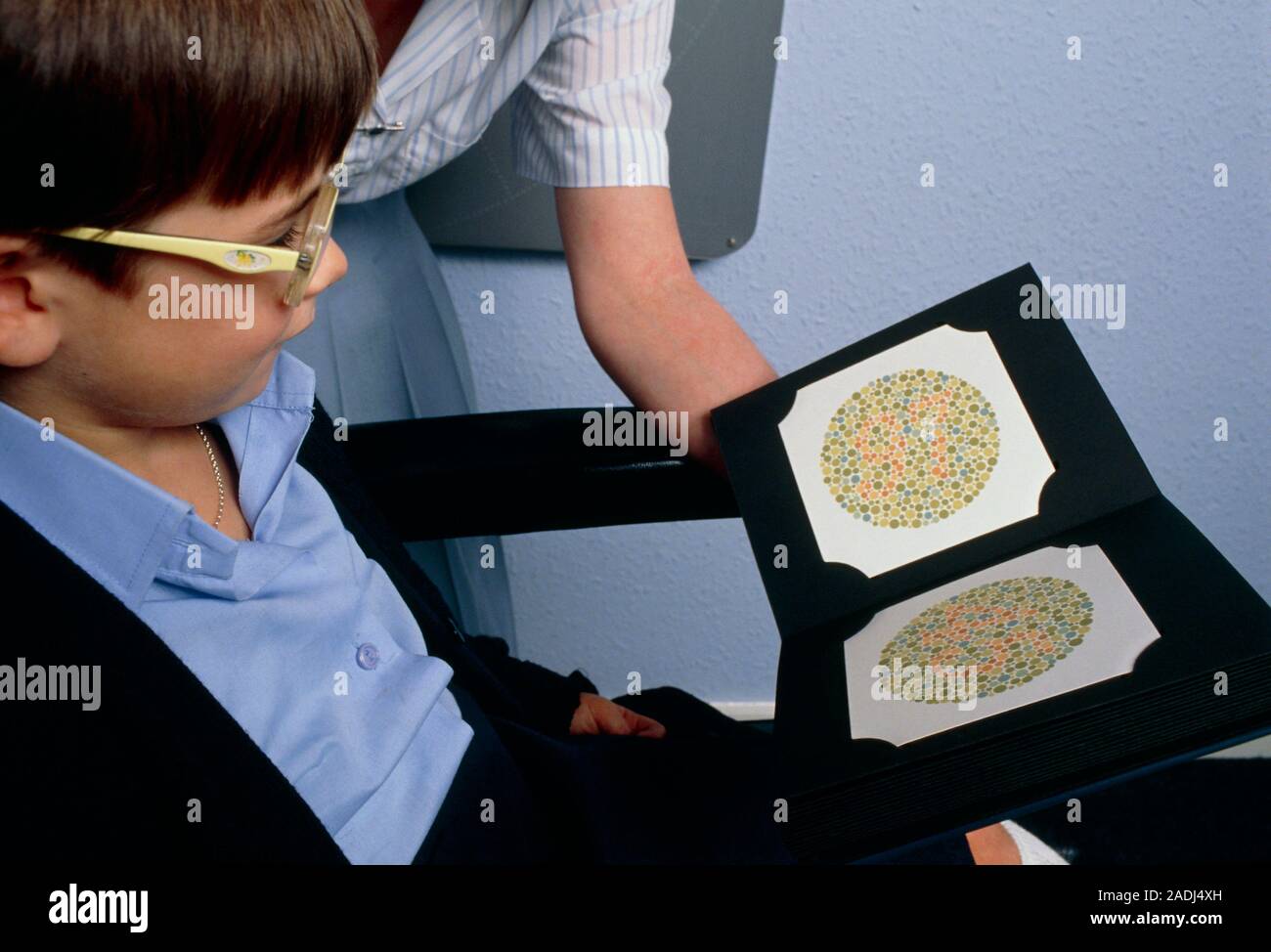 Young girl taking a colour-blindness test. People with normal vision ...