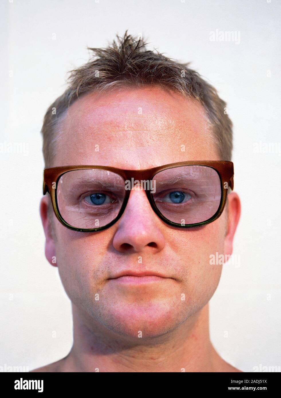 Man wearing glasses. Face of a man wearing a pair of optical glasses or ...