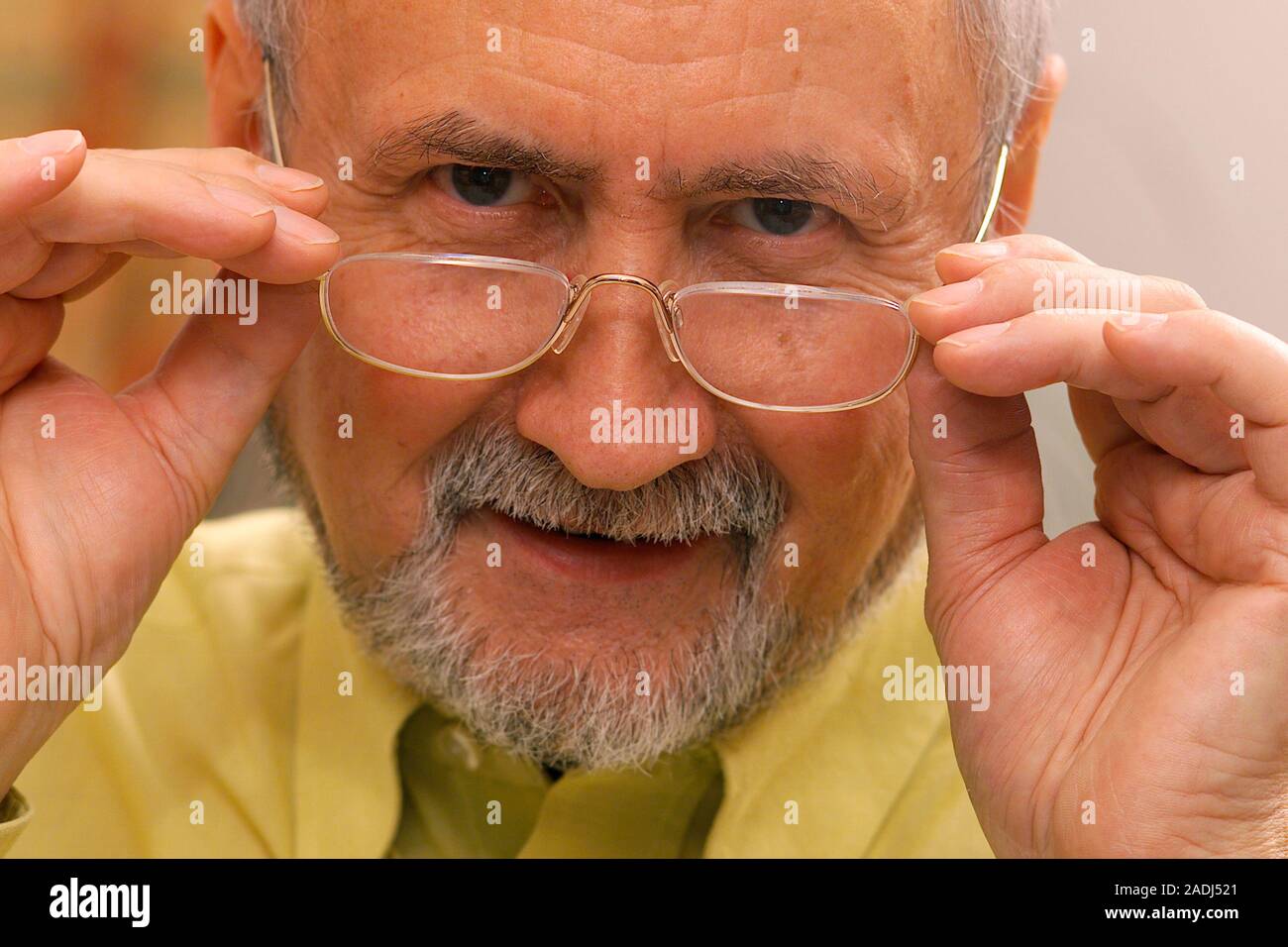 Man wearing spectacles. He is 65 years old. It is common for sight to ...