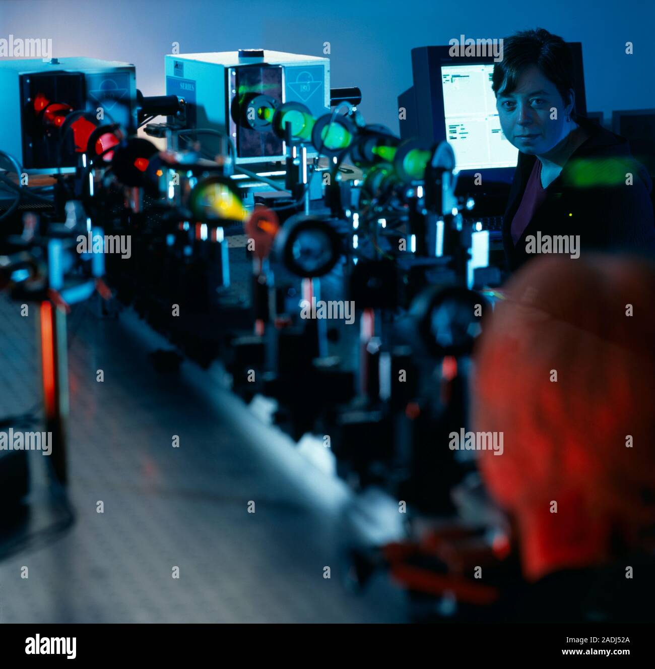 Four-colour vision research. Researcher (upper right) watching a woman ...