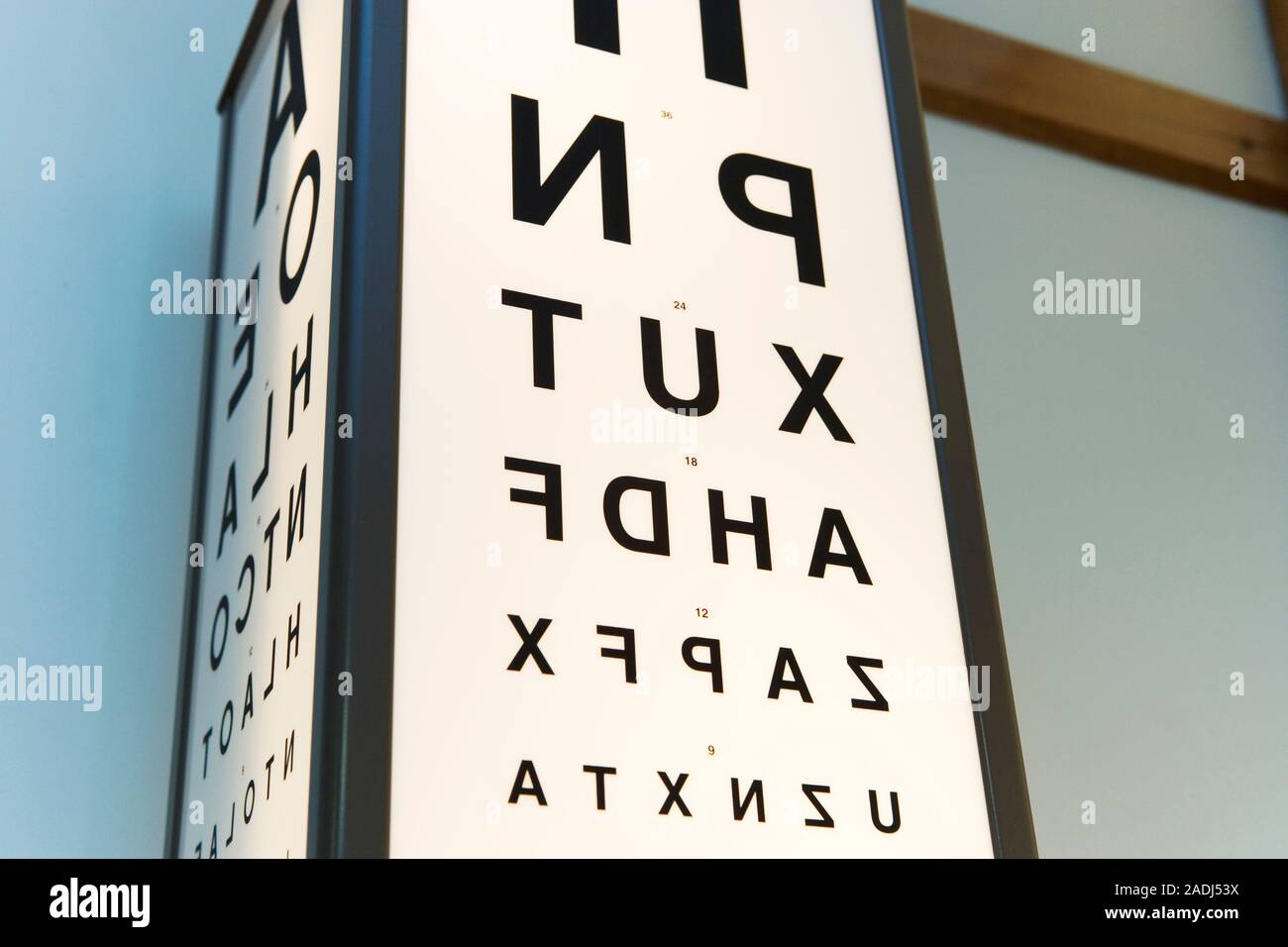 Eyesight test chart. Lightbox with rows of letters of varying size. The ...