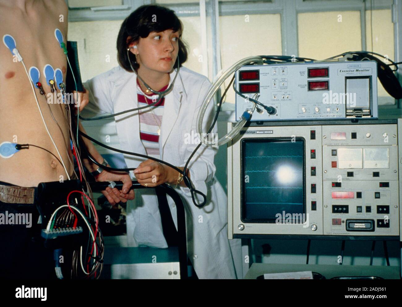 Patient wired to an electrocardiograph or ECG machine for measuring the ...