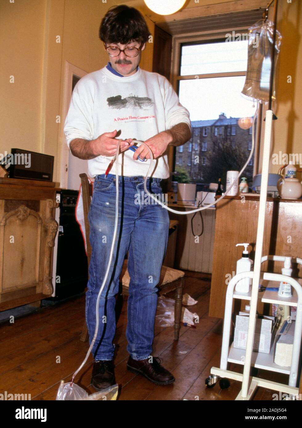 Home dialysis. Man using home dialysis equipment. This is Continuous ...