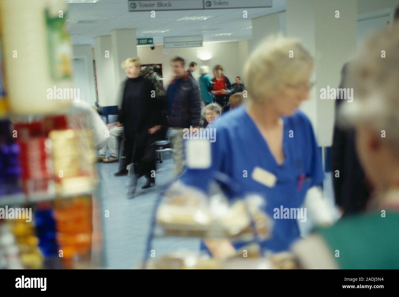 Hospital shop. Female member of medical staff using a hospital shop ...