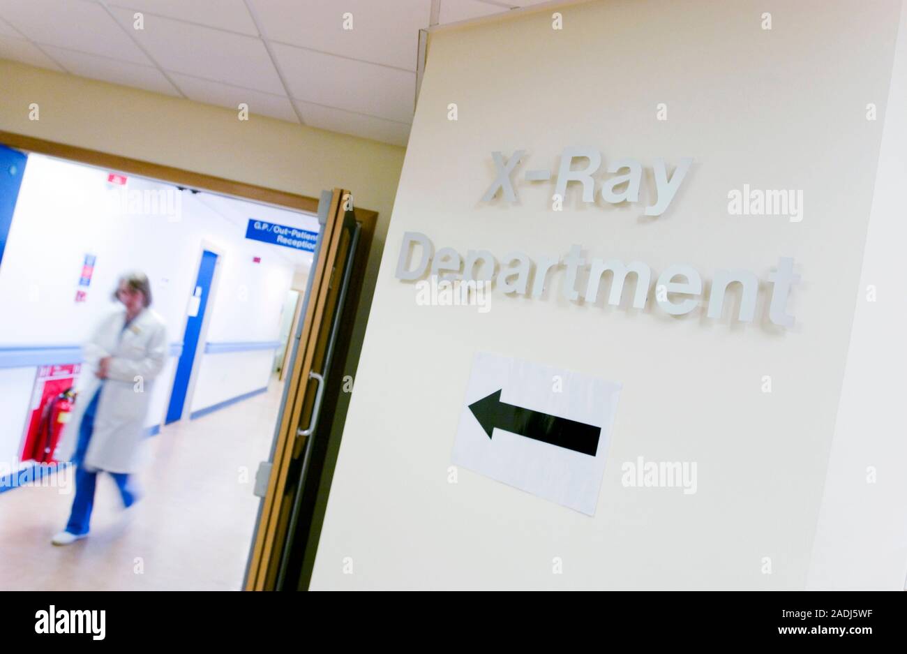 Hospital corridor and sign indicating the way to the X-ray department ...