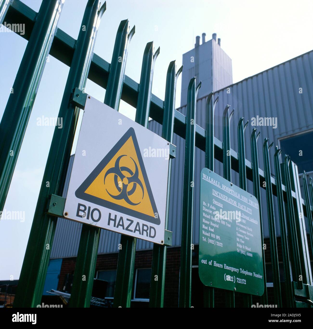 Hospital incinerator. Biohazard sign on the gates of an incinerator ...
