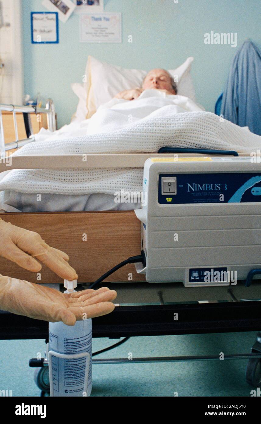 MODEL RELEASED. Hospital hygiene. Healthcare professional washing hands ...