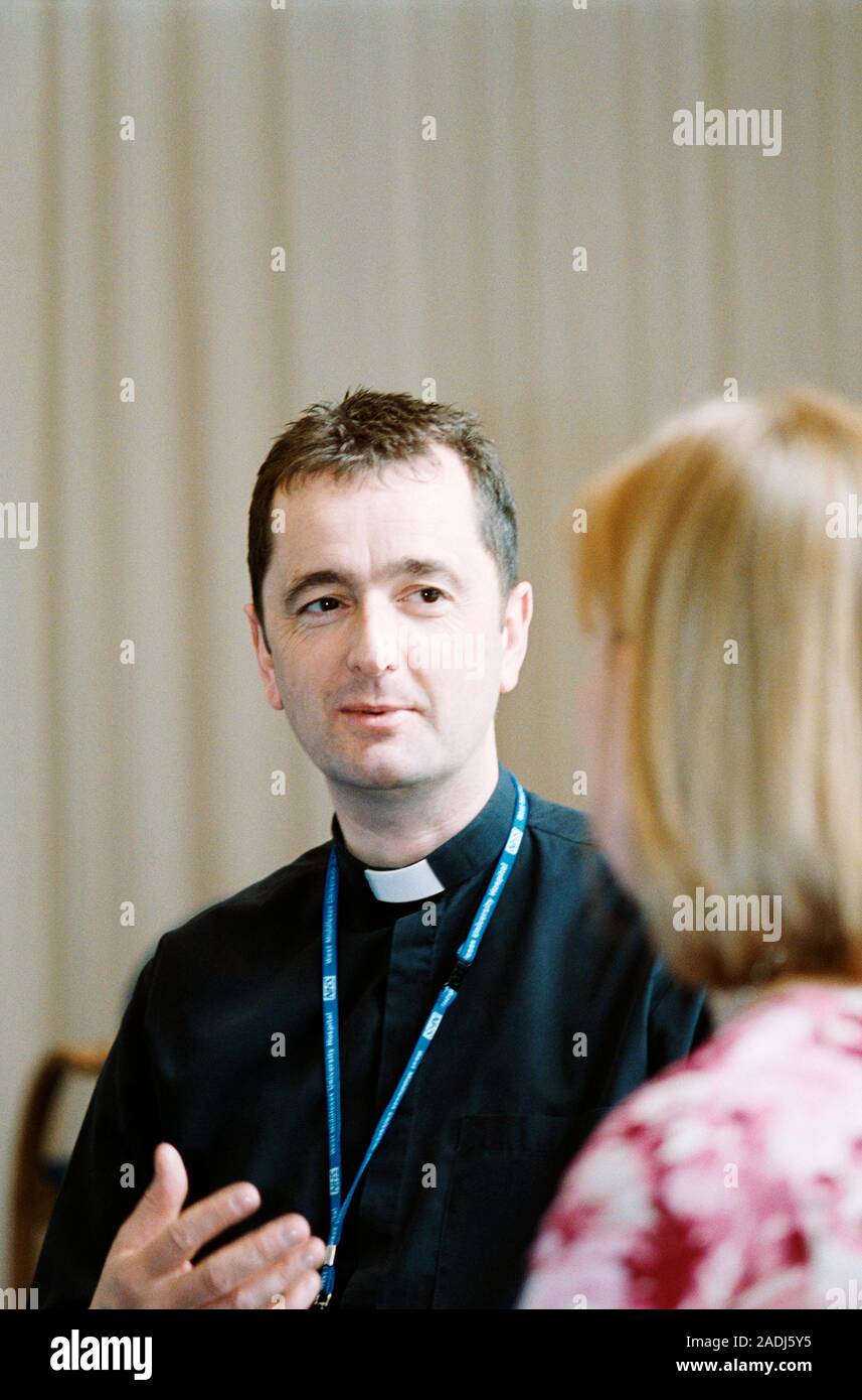 MODEL RELEASED. Chaplain giving support at a multi-faith centre in a ...