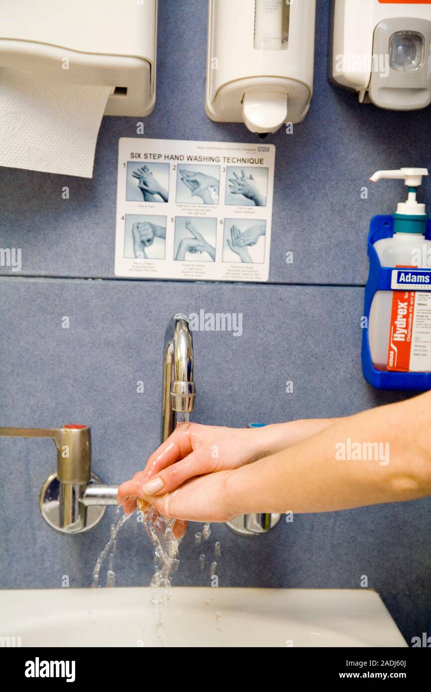 Hospital hygiene. Doctor washing her hands. A disinfectant soap ...