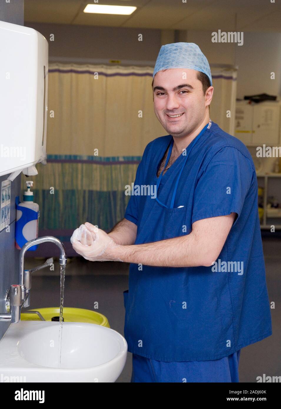 Hospital hygiene. Doctor washing his hands. A disinfectant soap ...