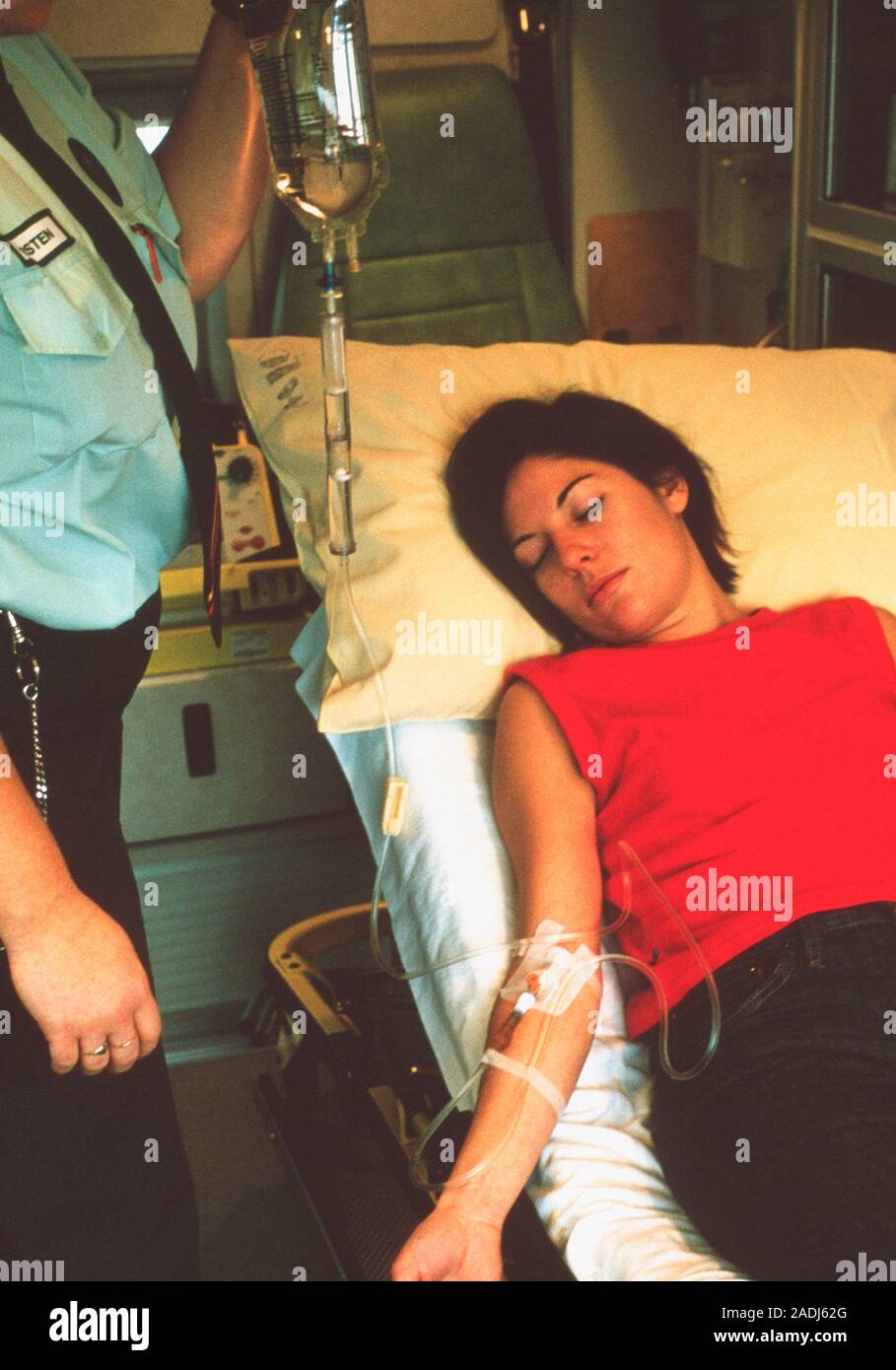 Ambulance treatment. Patient receiving emergency treatment in an ...