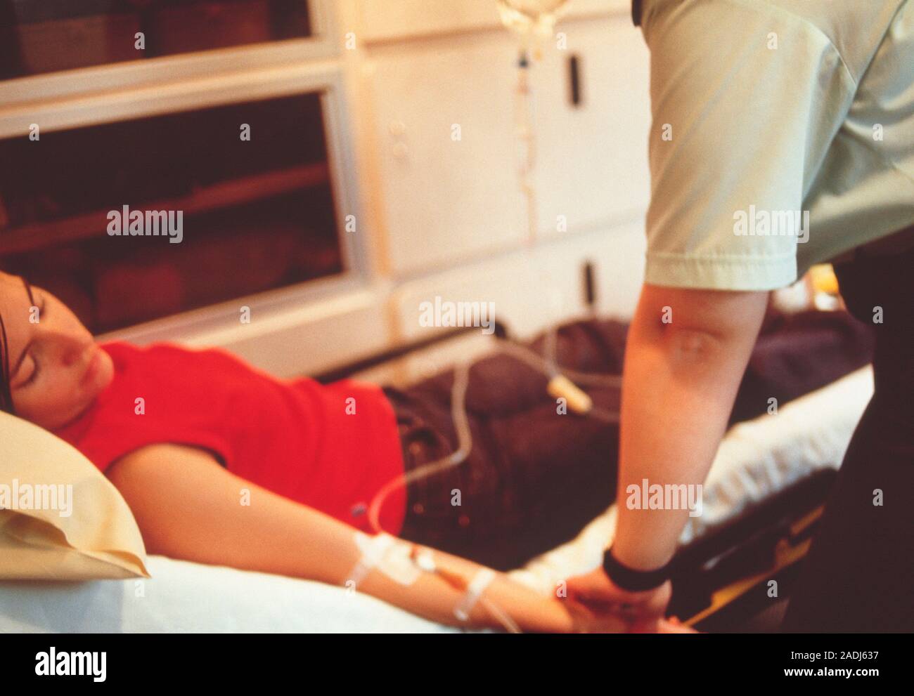 Ambulance treatment. Patient receiving emergency treatment in an ...