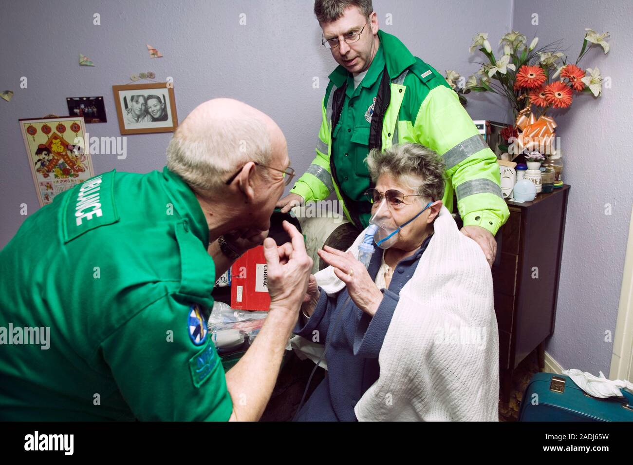 MODEL RELEASED. Emergency treatment. Ambulance technician and paramedic ...