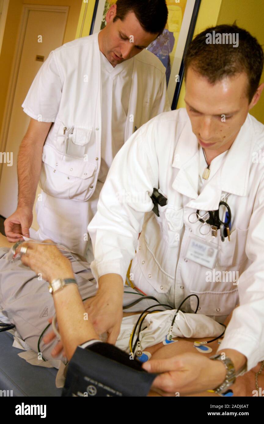 French emergency service. French paramedics treating a woman who is ...