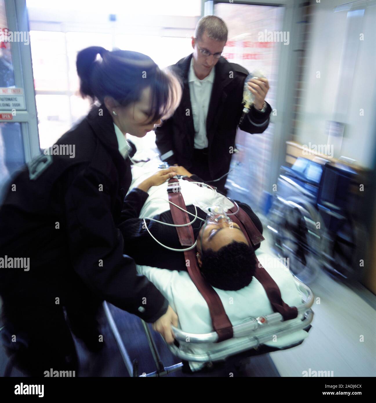 Emergency patient arriving at a hospital, time-exposure image. The ...