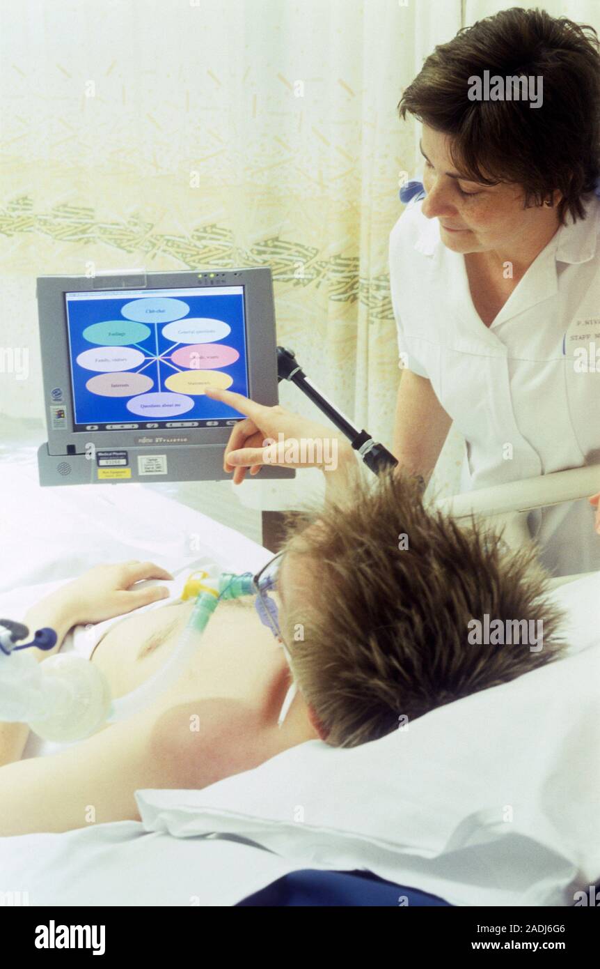 Patient communication. Intensive care patient using a touch screen ...