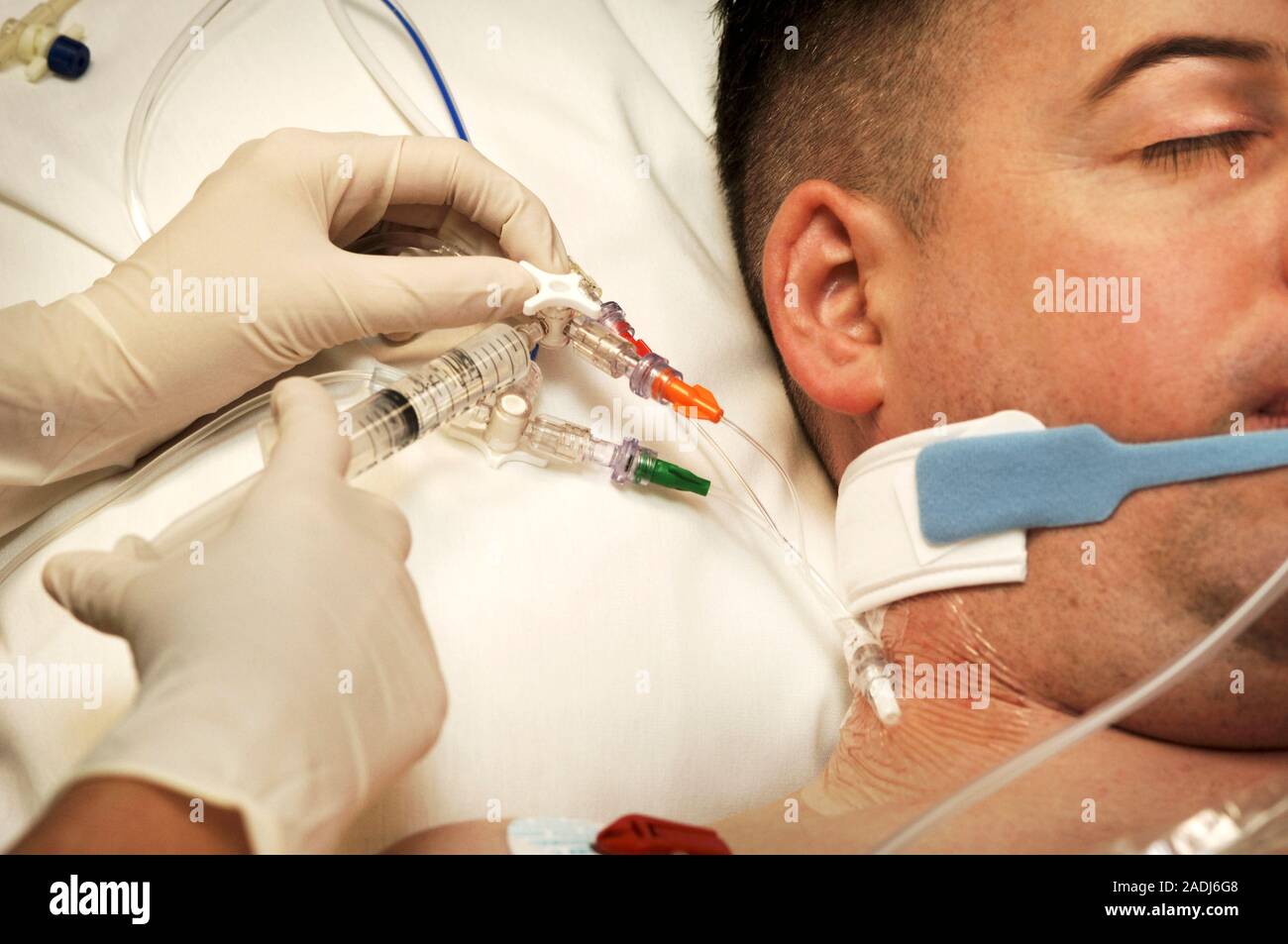 MODEL RELEASED. Drug administration. Nurse injecting drugs into an ...