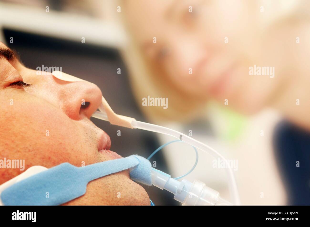 MODEL RELEASED. Intensive care patient. Side-view of the face of a male ...