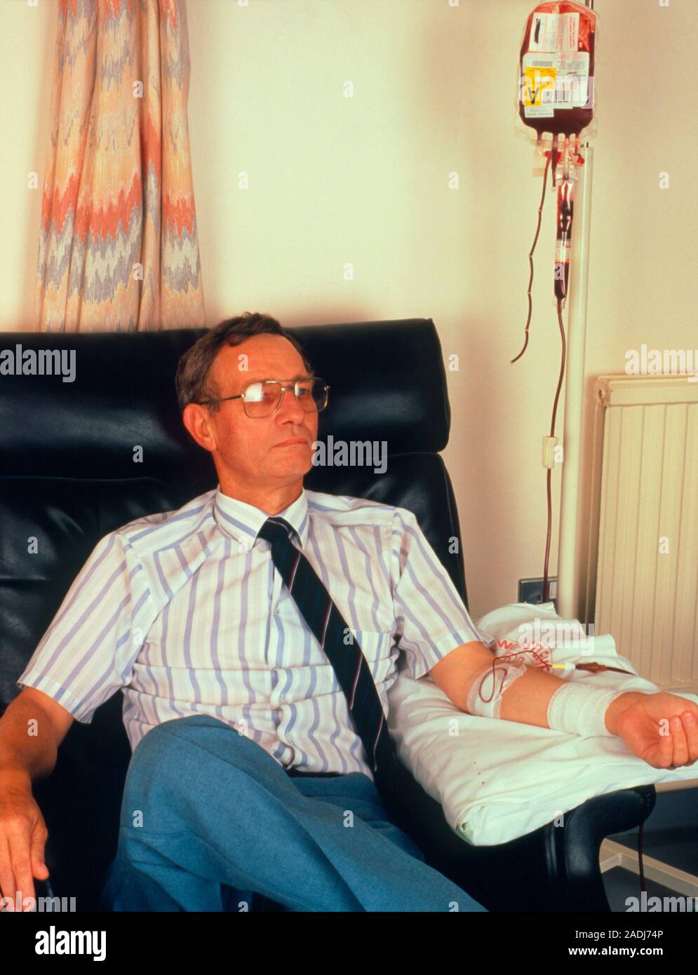 MODEL RELEASED: A patient undergoing a blood transfusion Stock Photo ...