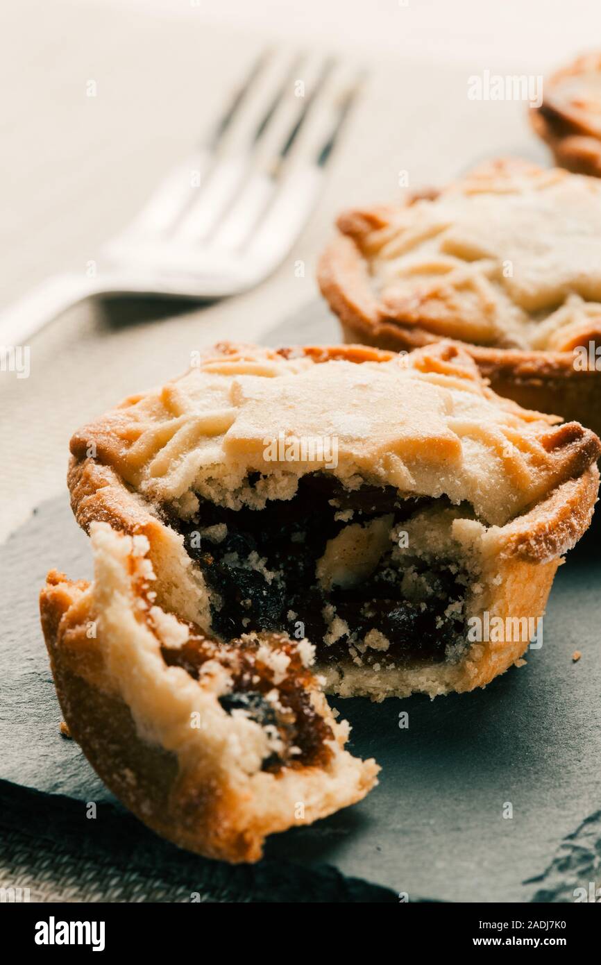 Broken off mince pie with sweet blueberry filling Stock Photo - Alamy
