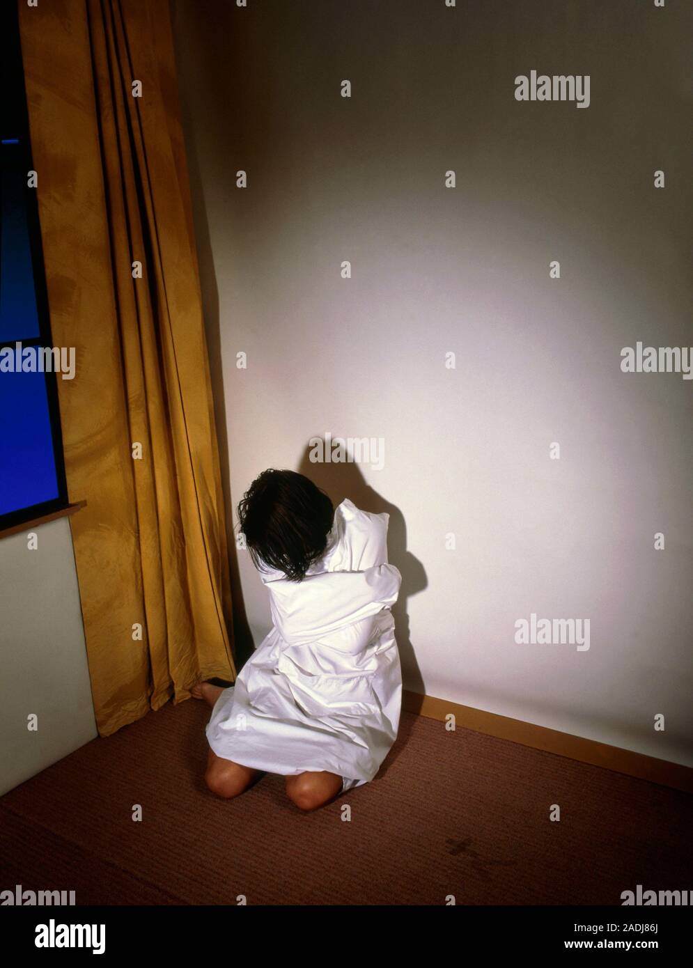 Psychiatric patient. View of a mental patient with bowed head ...