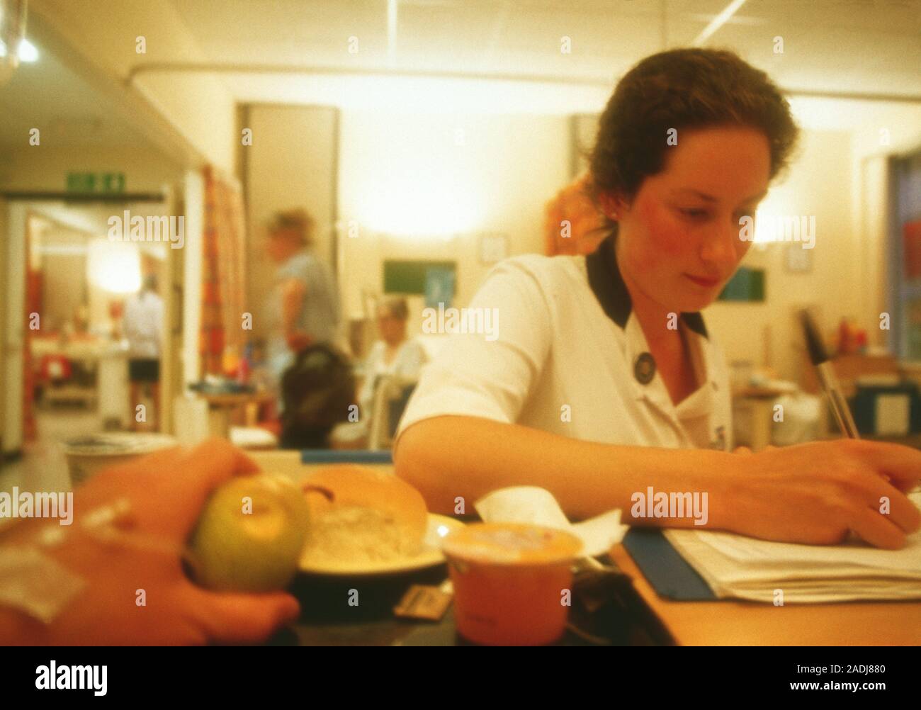 Ward rounds. Patient's eye view of a nurse at work in a hospital ward ...