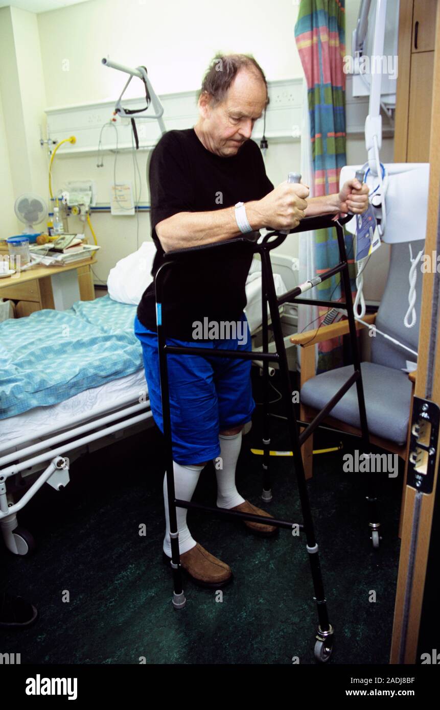 MODEL RELEASED. Man standing using frame. Man standing, with the aid of ...