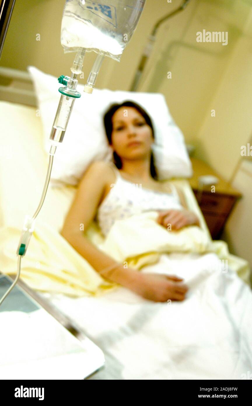 MODEL RELEASED. Patient on a ward. Patient connected to an intraveneous ...