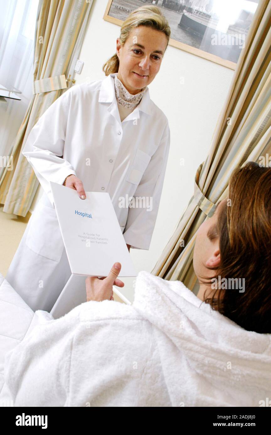 MODEL RELEASED. Doctor and patient meeting during a ward visit. The ...