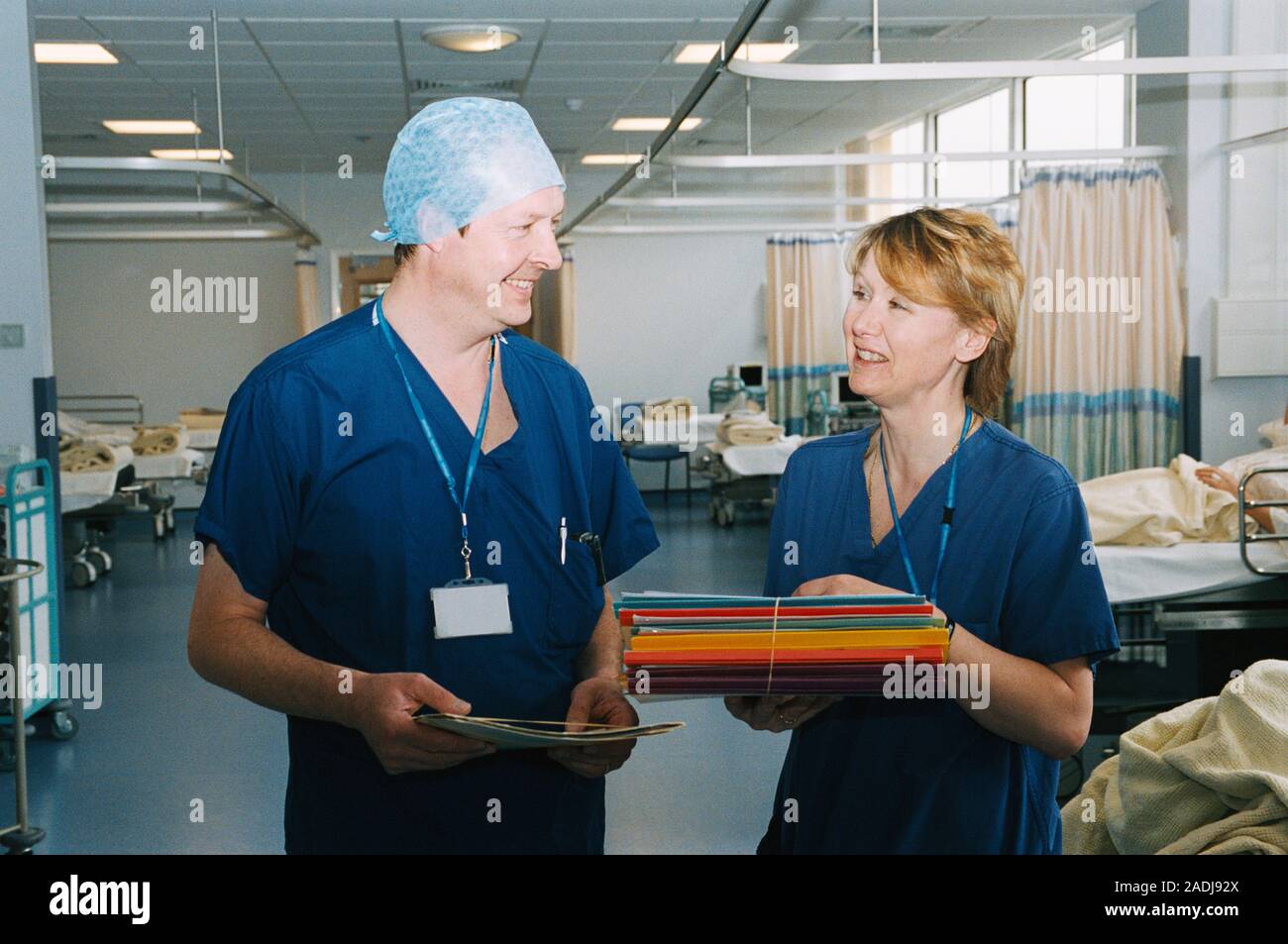 MODEL RELEASED. Patient handover. Health professional who has just ...