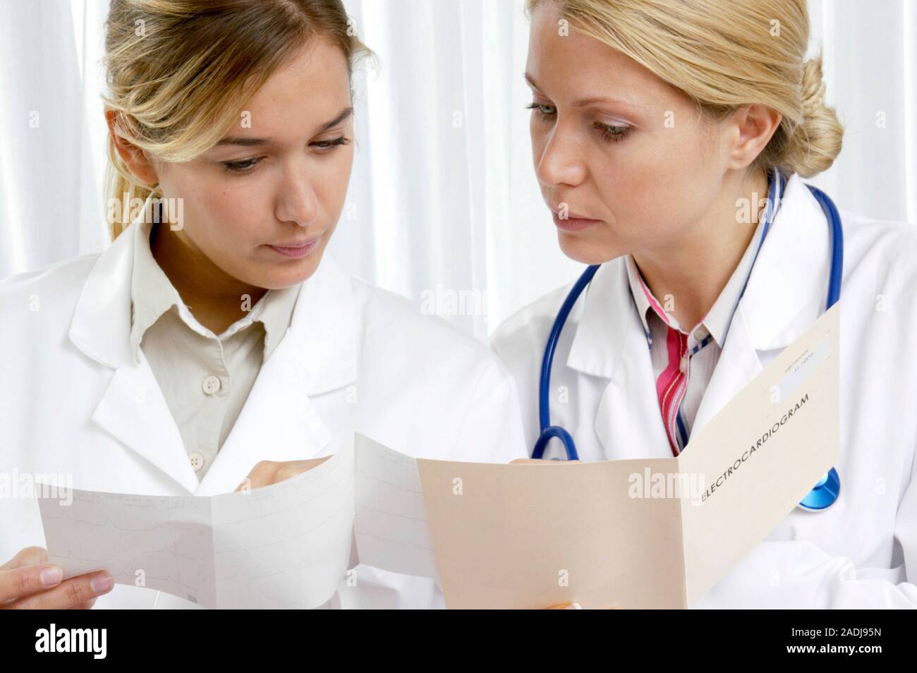 MODEL RELEASED. Test results. Doctors discussing the results of a ...