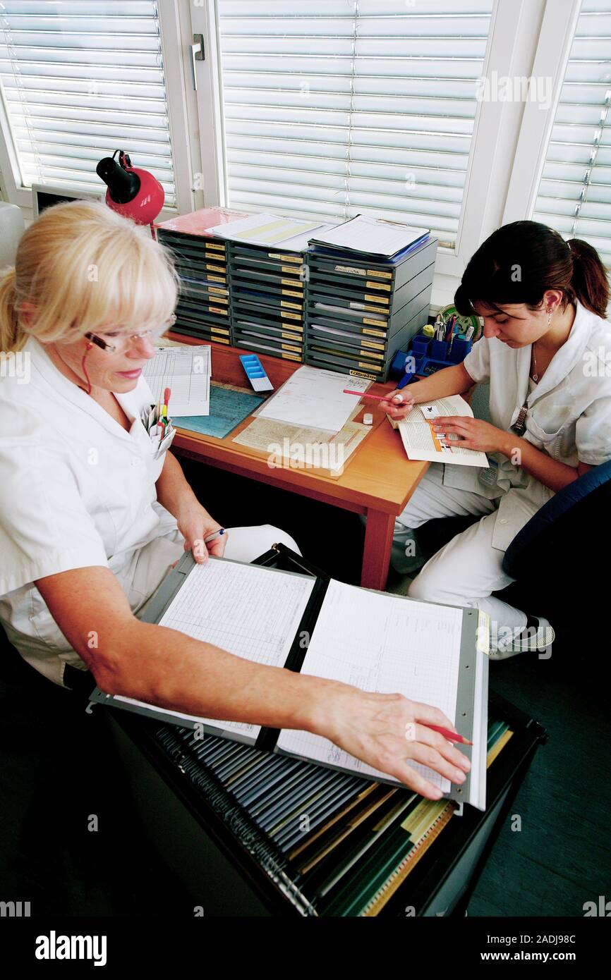 Hospital administration. Medical staff working in a hospital office ...