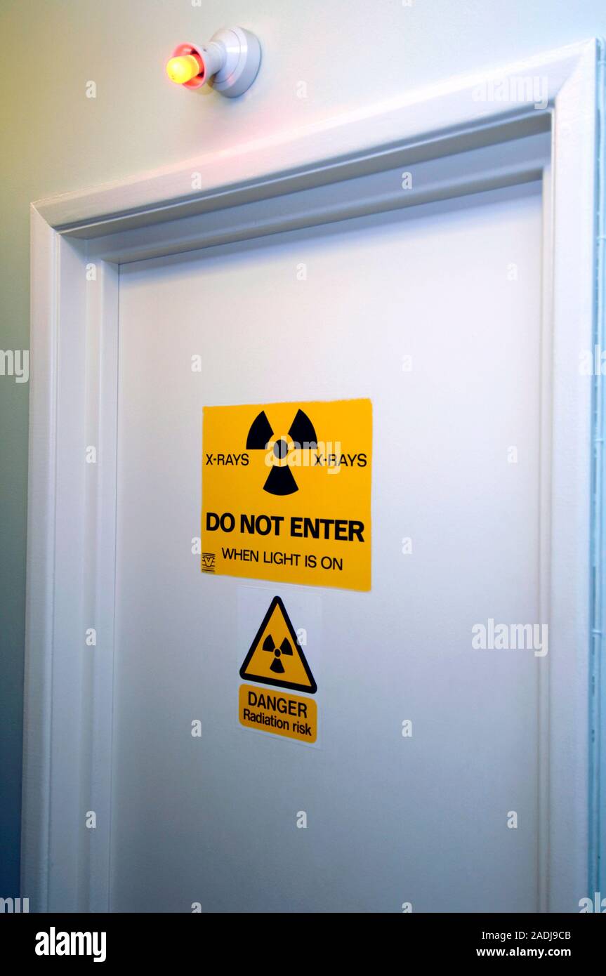 X-ray warning light and sign outside of a radiography department. The ...