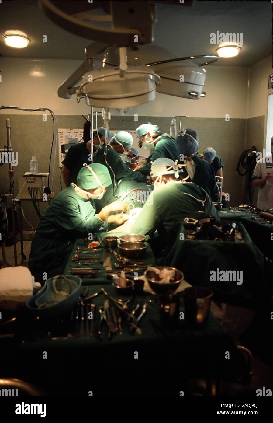 View of an operating theatre and surgical team, showing two surgeons ...