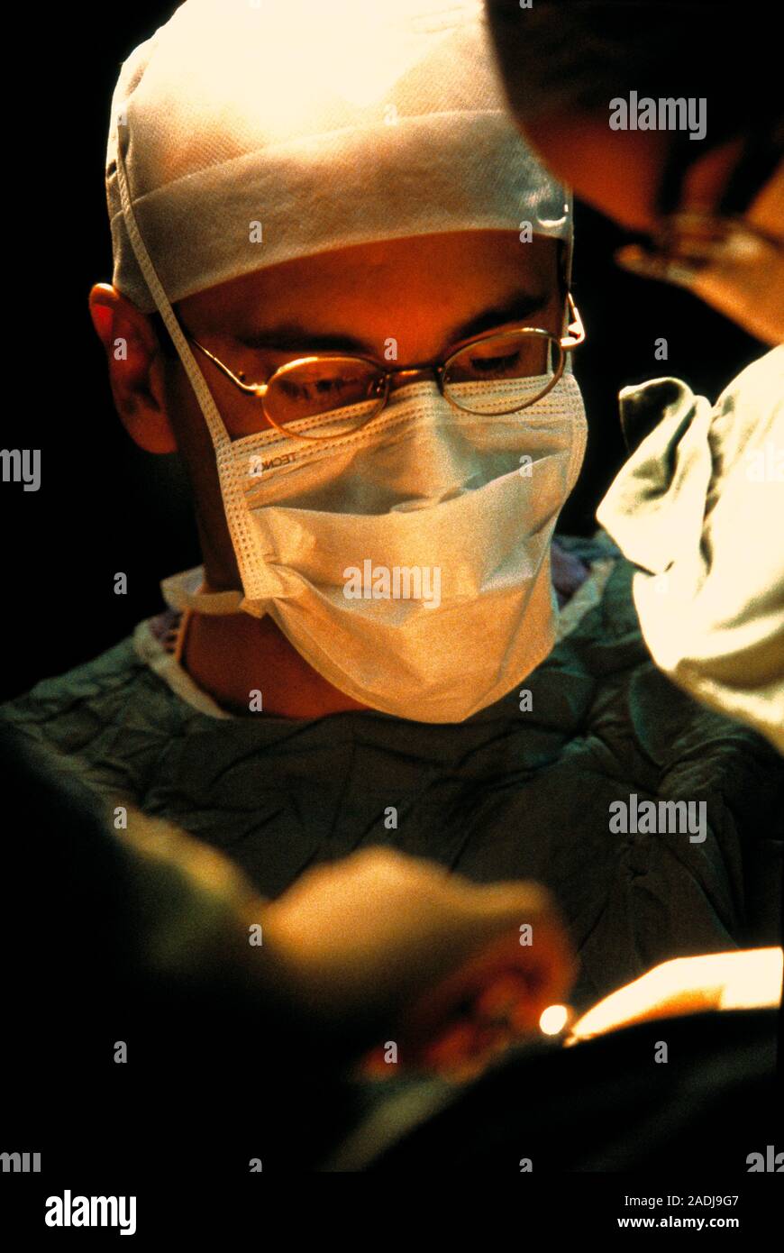 MODEL RELEASED. Surgeon. Close-up of a male surgeon's face during ...