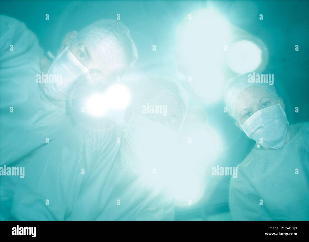 Surgery. Semi-conscious patient's view of a surgical team about to ...