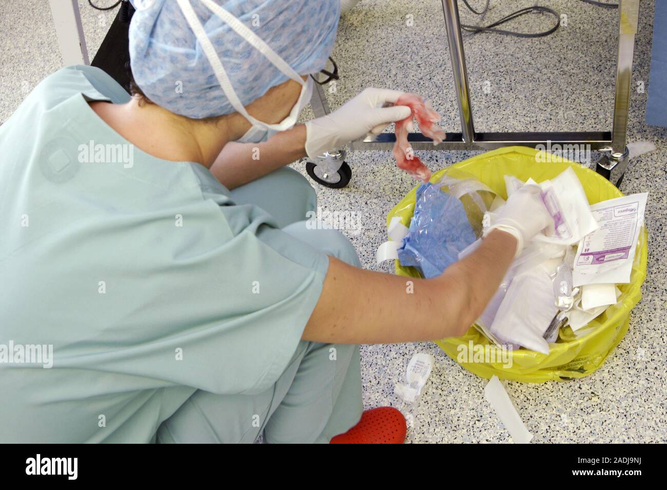 Nurse counting compresses to check that none have been left in the ...