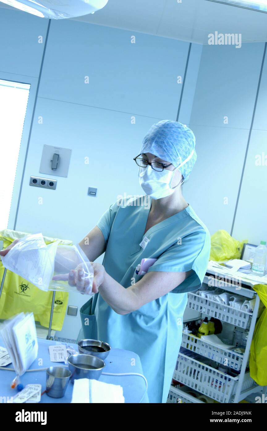Nurse in an operating theatre Stock Photo - Alamy
