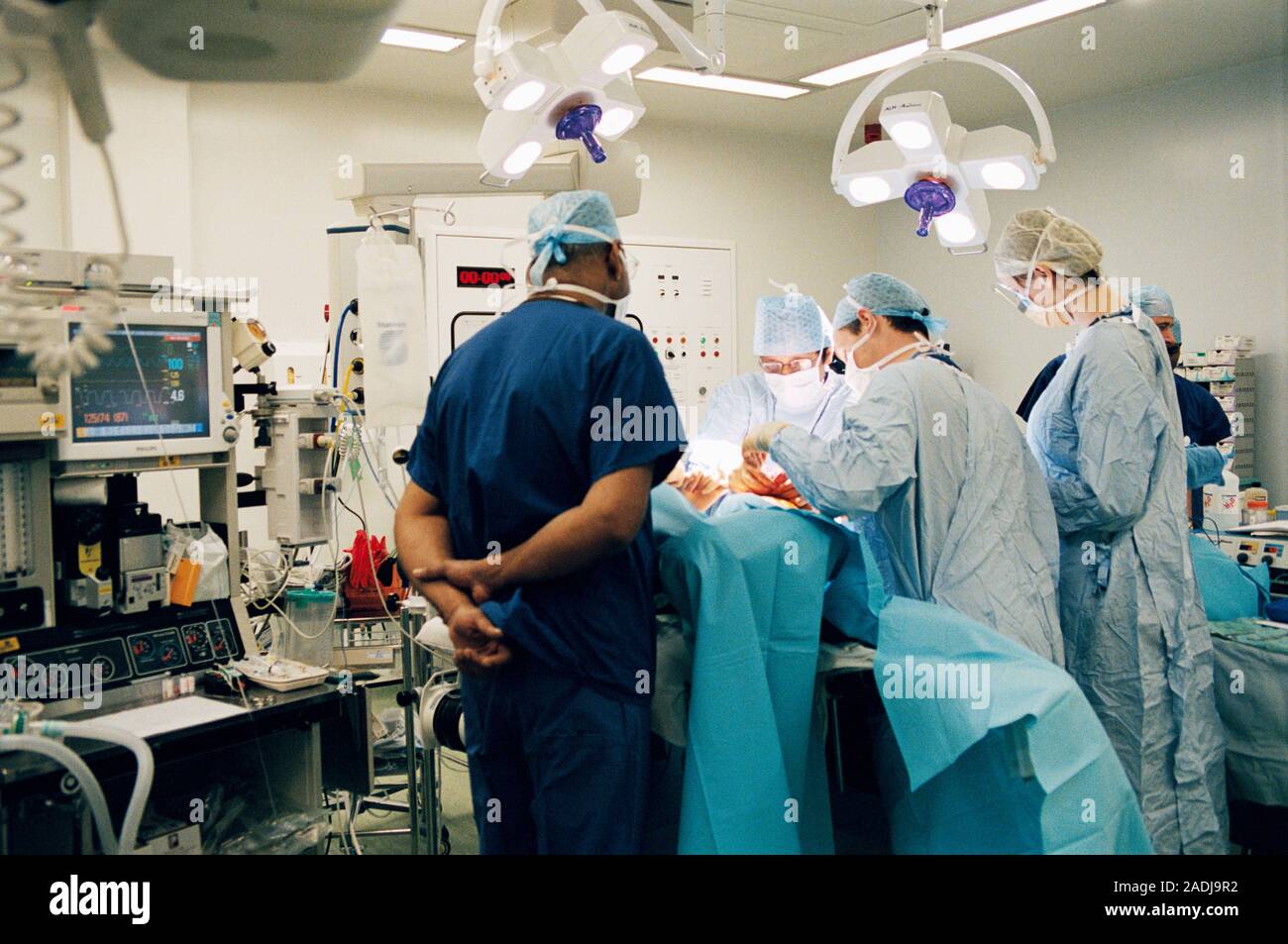 MODEL RELEASED. Surgery. Consultant and his team operating during ...