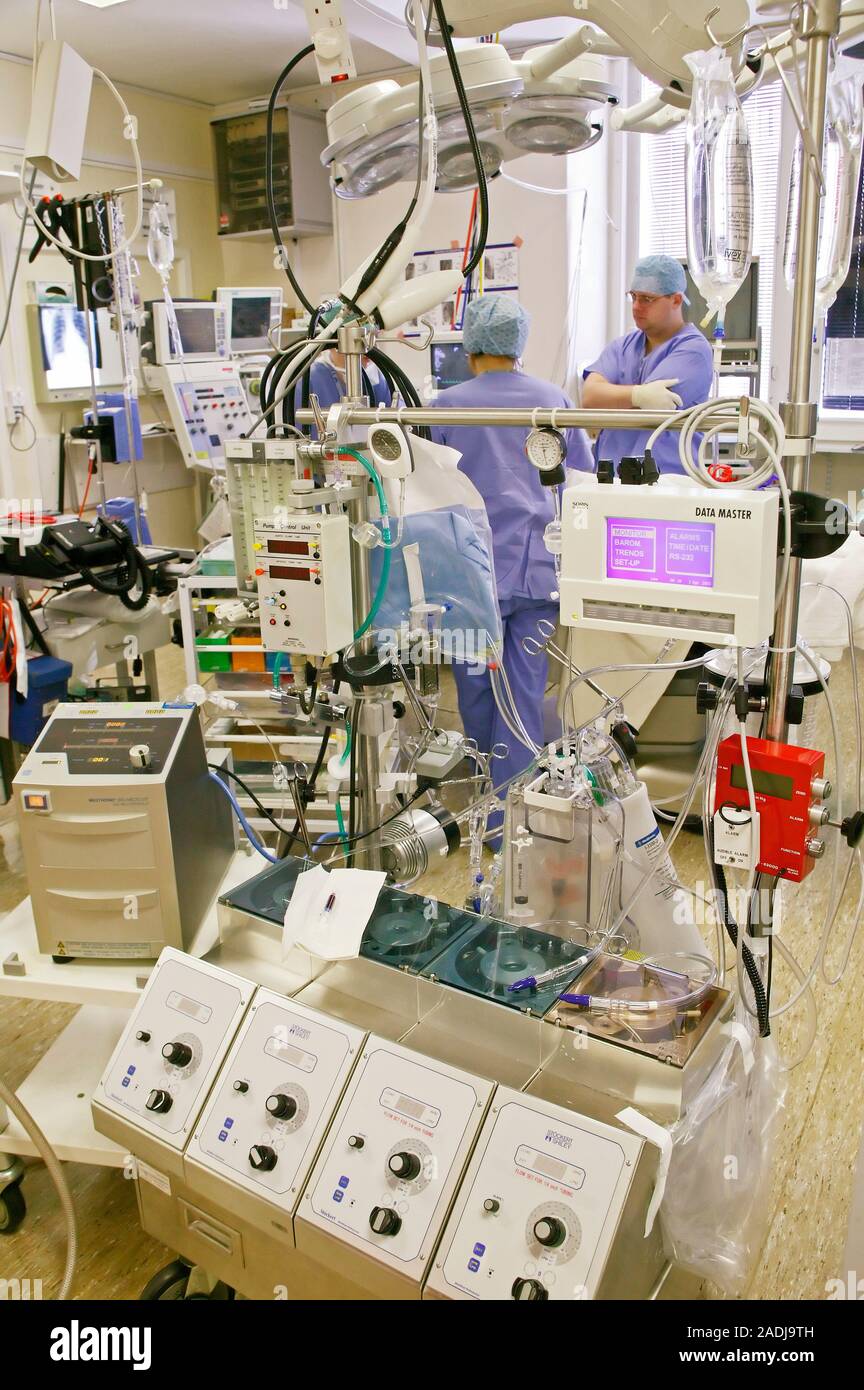 MODEL RELEASED. Surgery. Surgeons in an operating theatre. In the ...