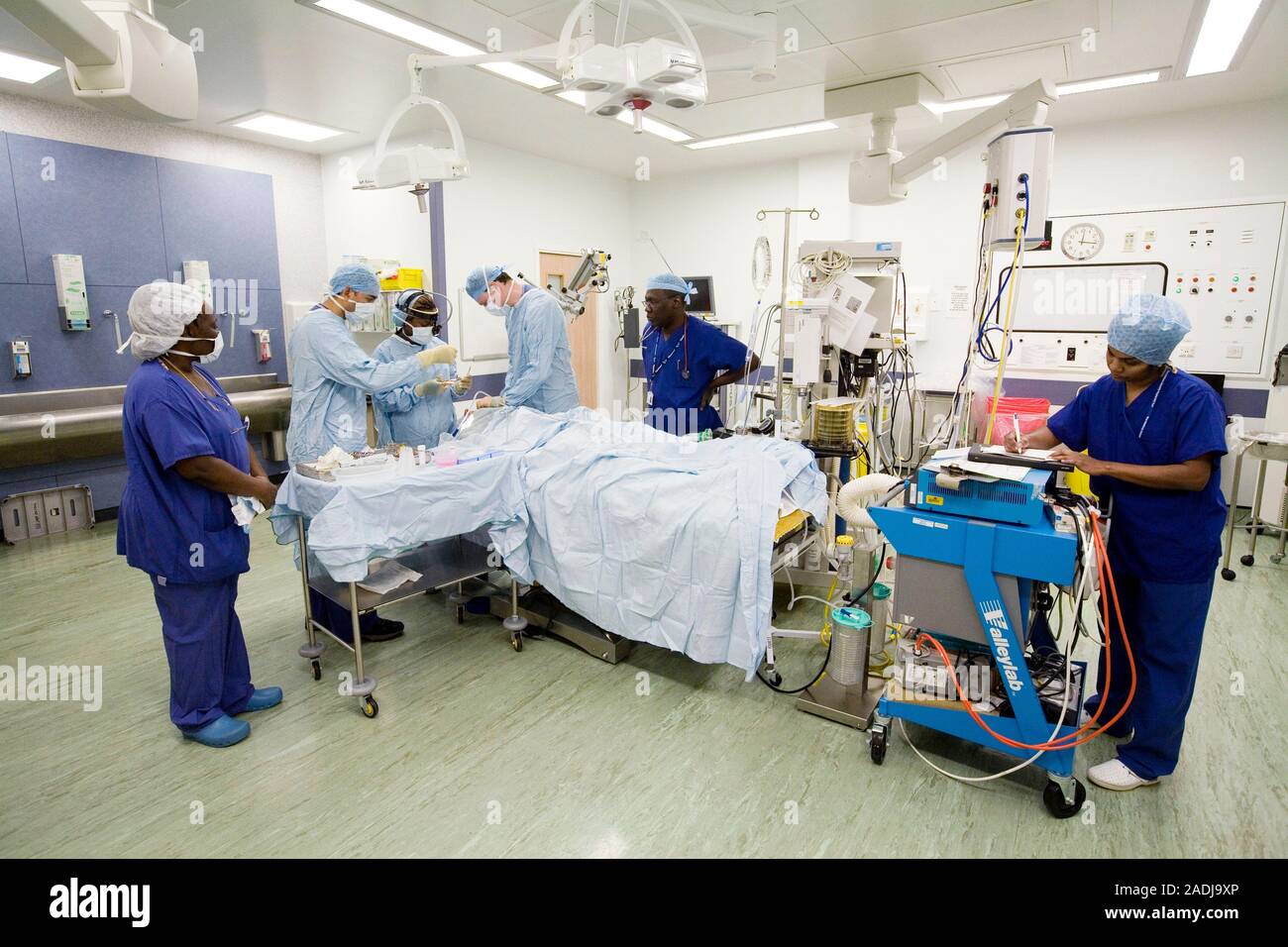 Operating theatre. Surgeons performing an operation on a patient Stock ...