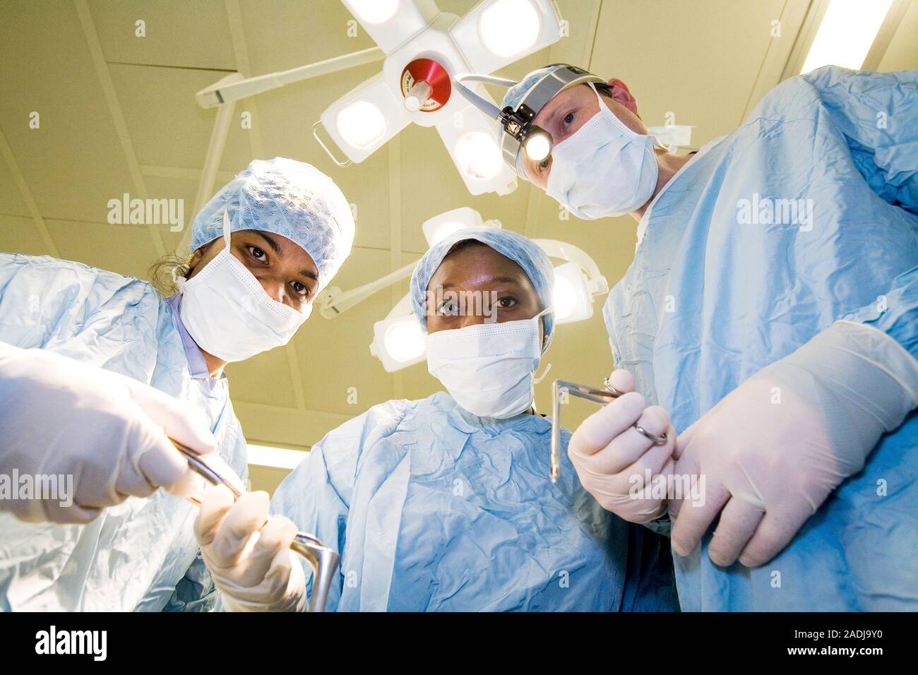 Surgeons. Patient's-eye view of surgeons in an operating theatre before ...