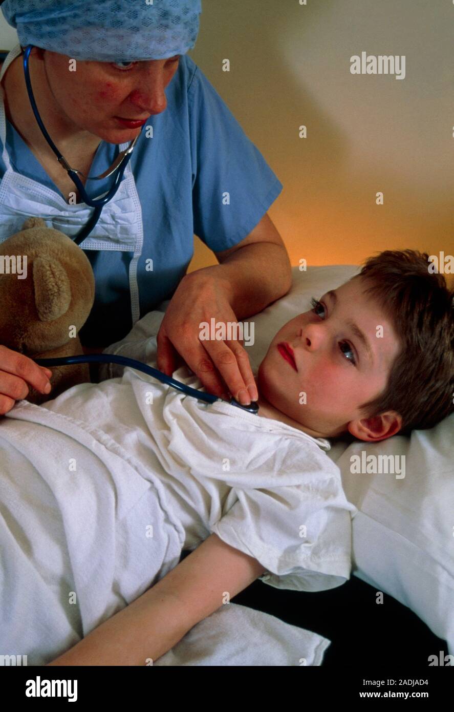 MODEL RELEASED. Child awaits surgery. A six year- old boy lies on a ...