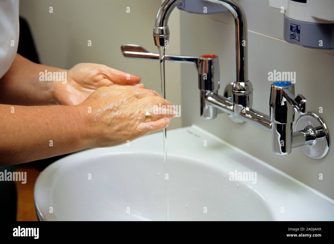 Washing hands. Hospital worker washing their hands. Cleanliness and ...