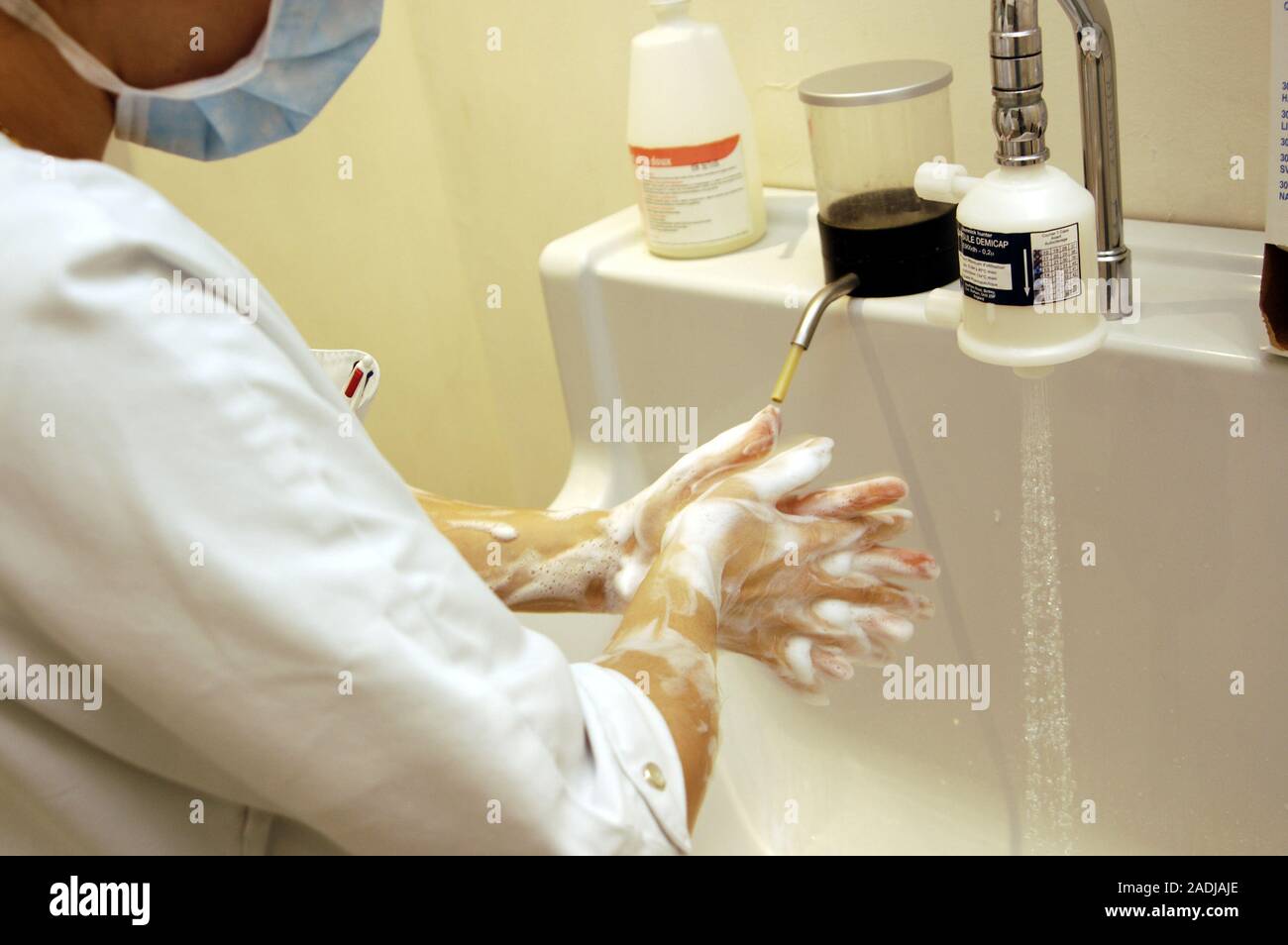 Nurse 'scrubbing up' before an operation. Rigorous hygiene is essential ...